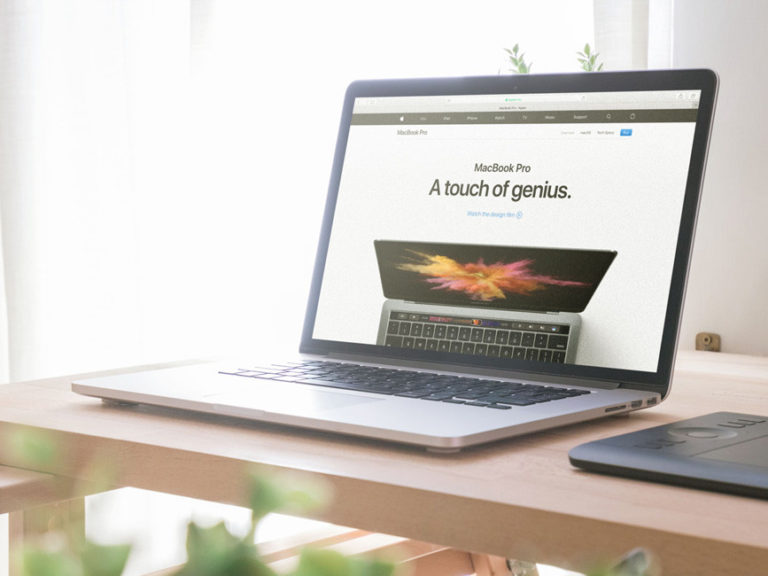 Macbook on Office Table Mockup - Mockup Love