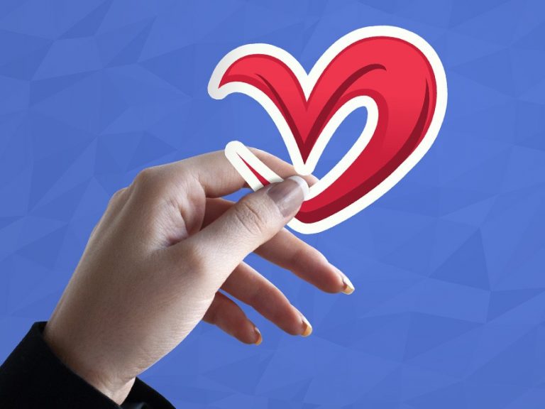 Realistic Sticker in Hand Mockup - Mockup Love